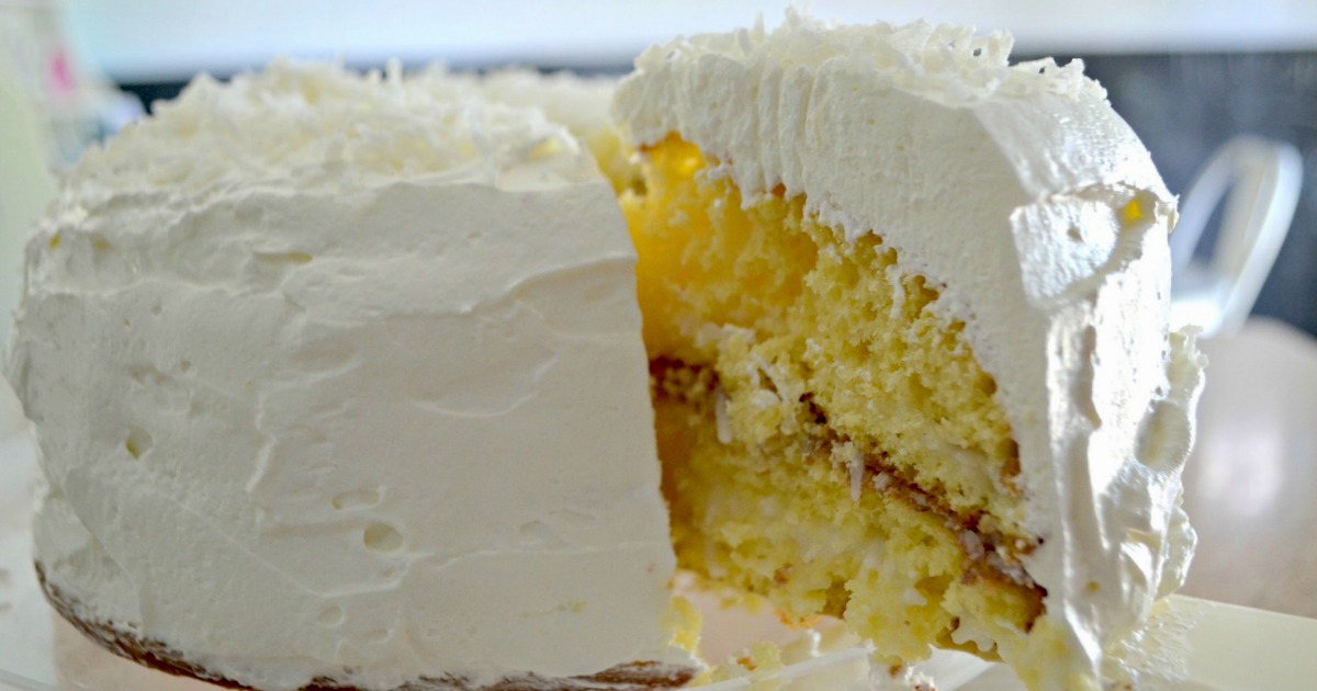 Easy Coconut Cake with Layers of Sweetened Frosting | Hip2Save